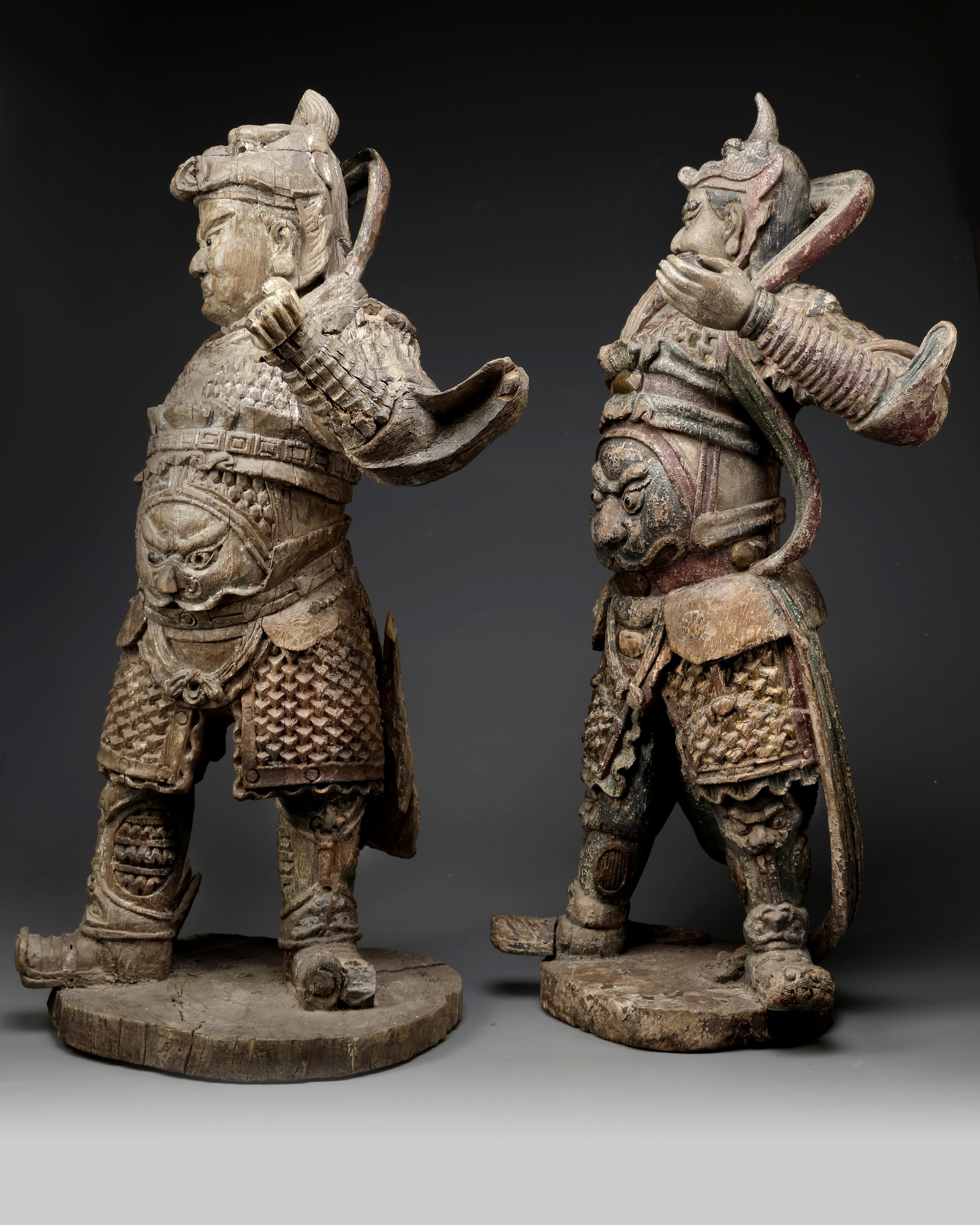 A matched pair of Chinese polychrome wood guardian figures