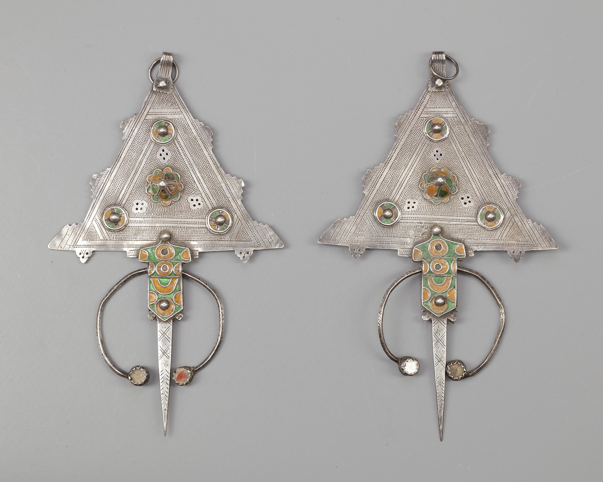 A PAIR OF MOROCCAN OR ALGERIAN SILVER FIBULA, 19TH-20TH CENTURY