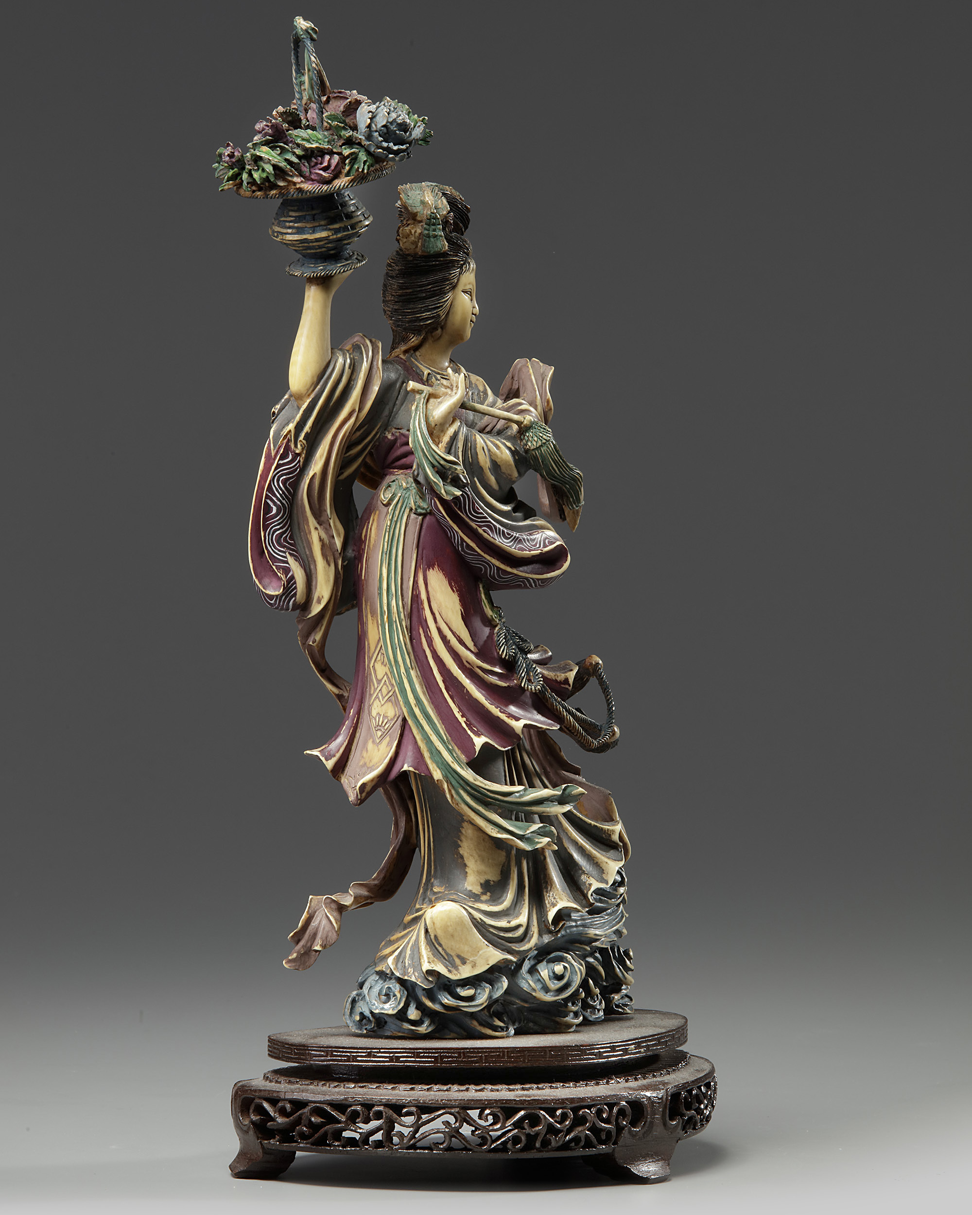 A Chinese polychrome-decorated ivory figure of a maiden