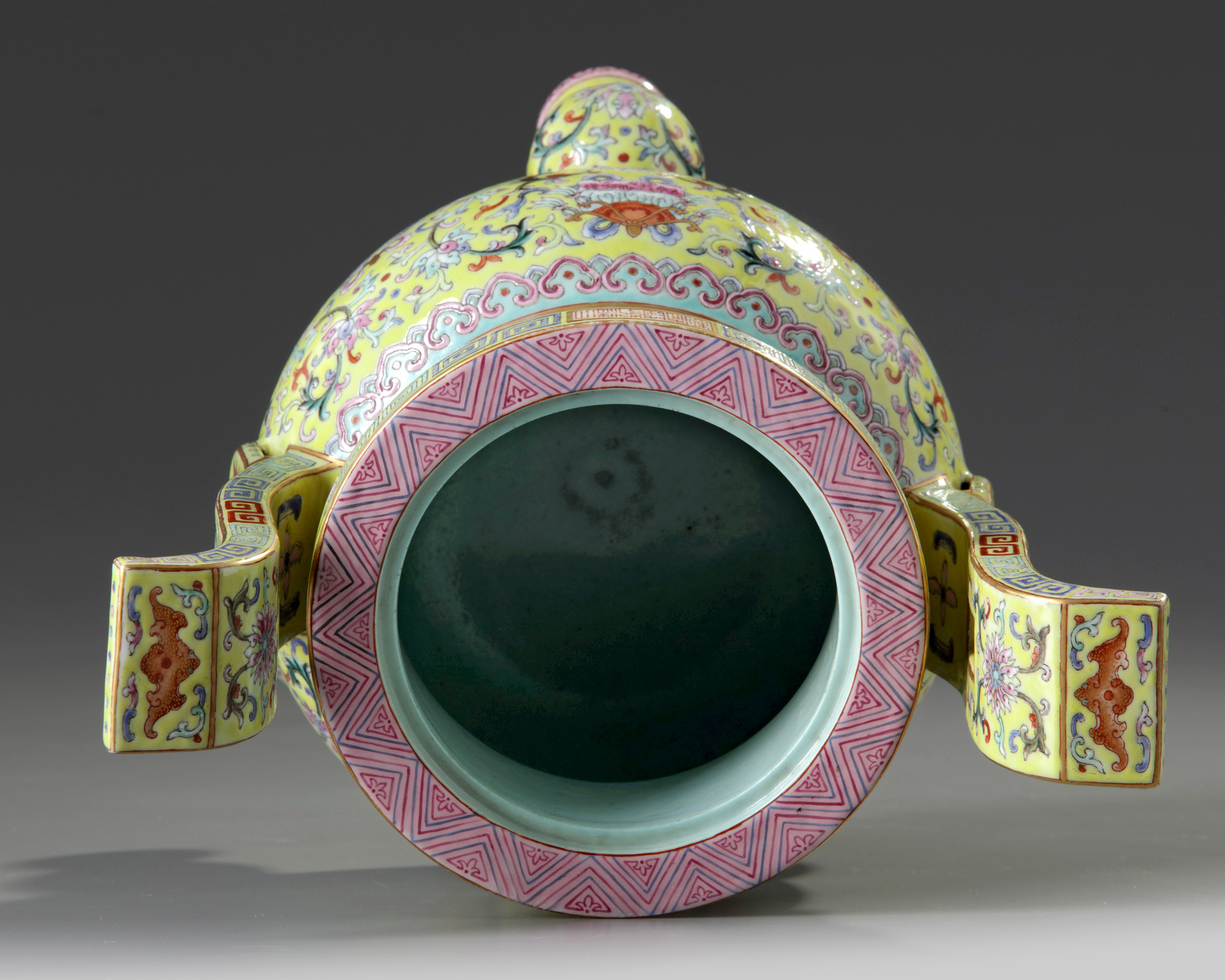 A Chinese yellow-ground famille rose tripod censer