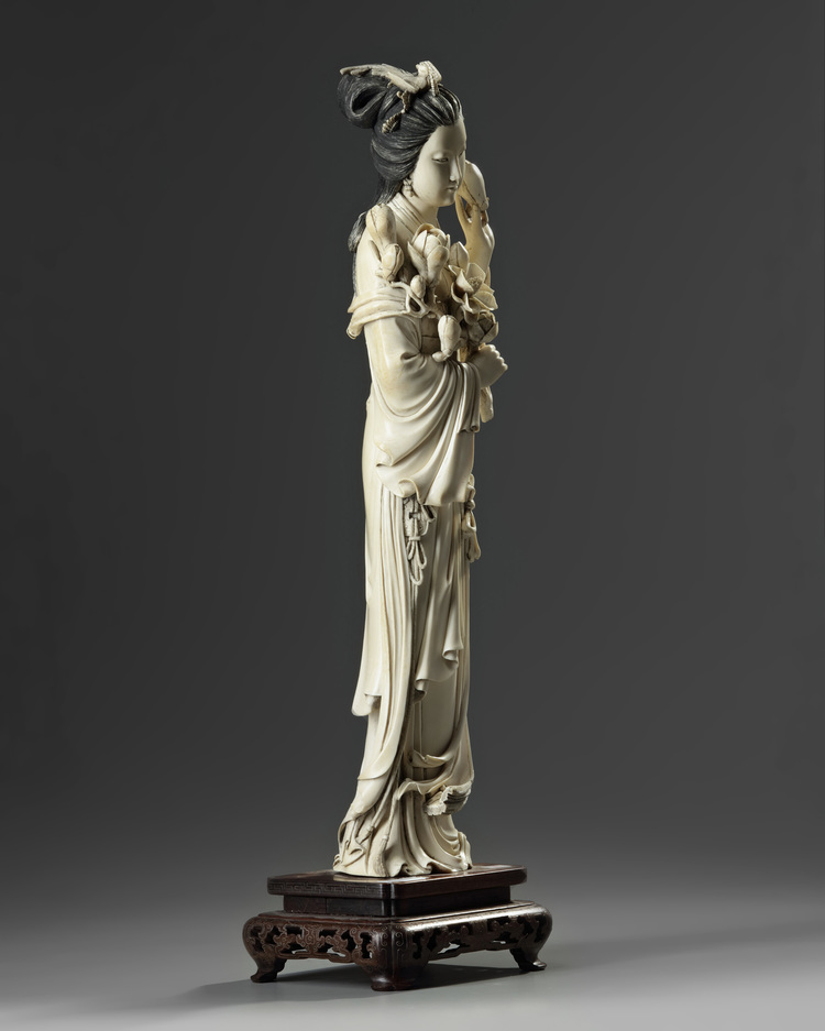 A large Chinese ivory carving of a lady