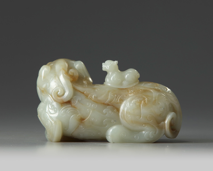 A CHINESE CELADON AND RUSSET JADE BUDDHIST LION WATER DROPPER, CHINA ...