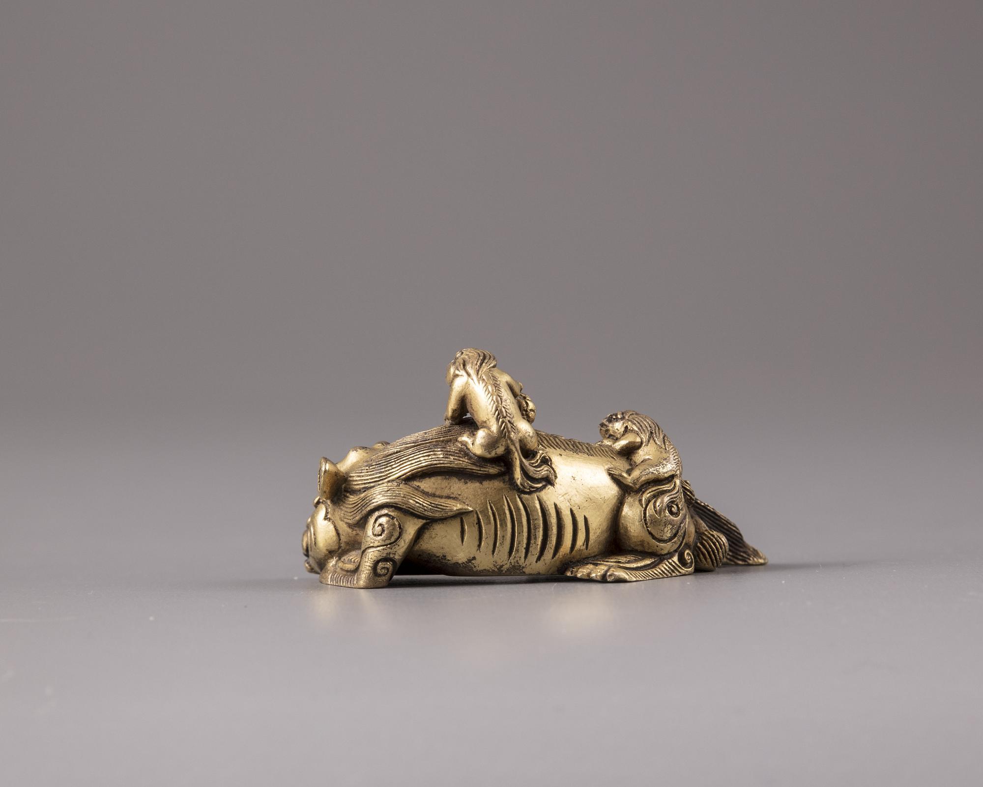 A gilt bronze paperweight
