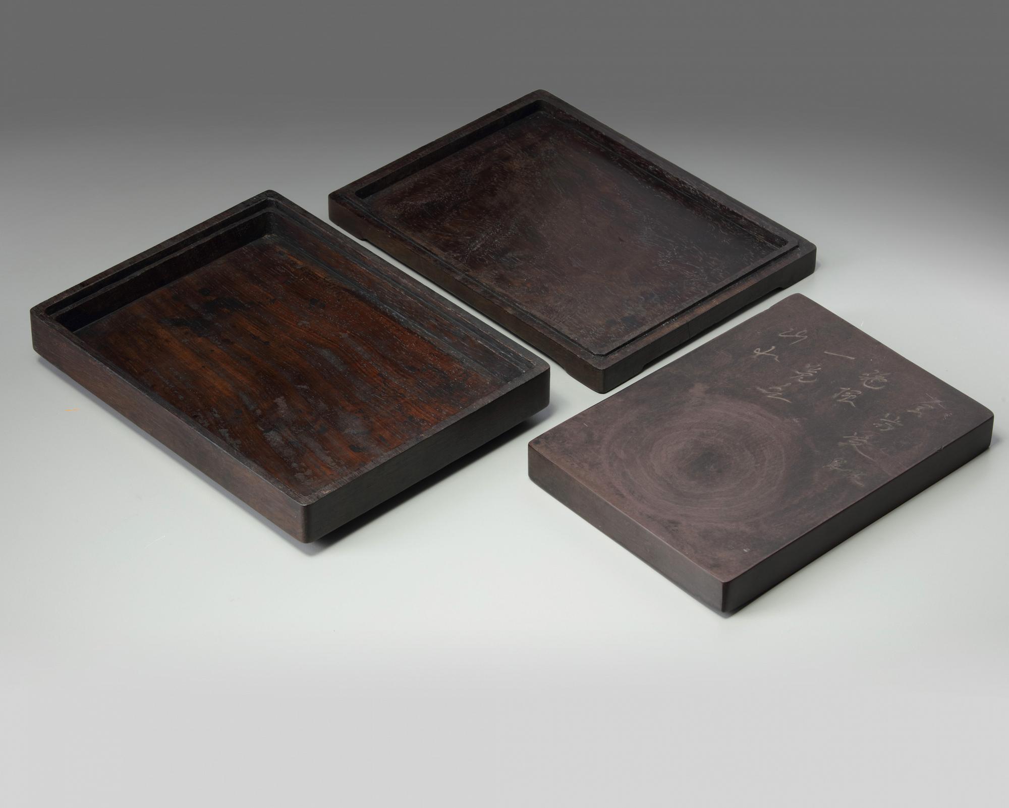 A Chinese ink stone in a wooden box