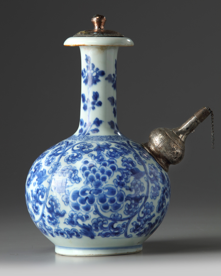 A SILVER-MOUNTED CHINESE BLUE AND WHITE 'FLOWER SCROLL' KENDI, KANGXI ...