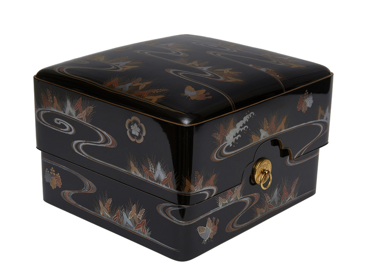 A large black Japanese lacquered box with a curved lid
