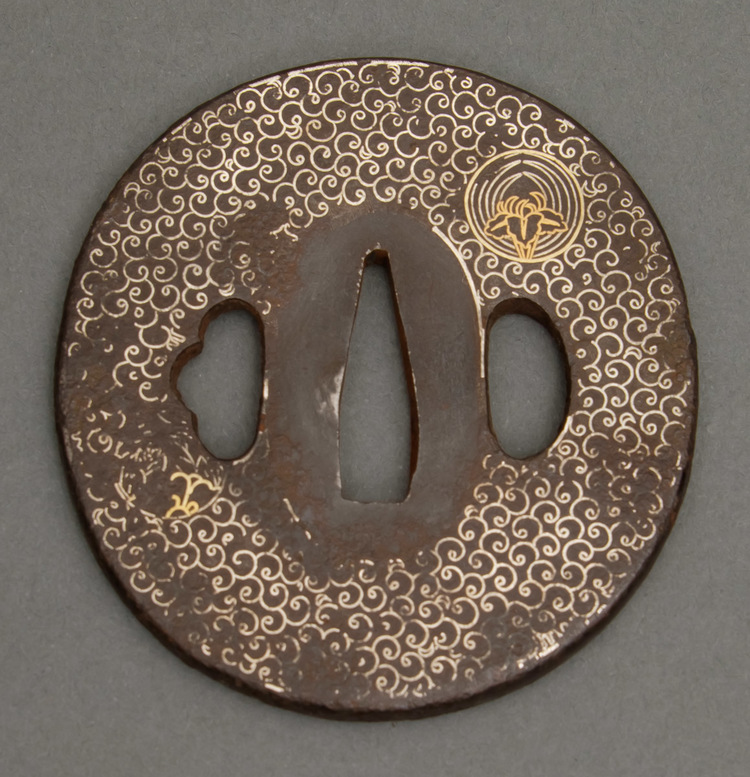 A Japanese Oval sword guard (tsuba)