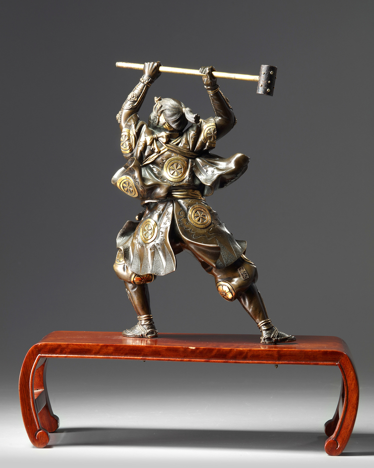 A Japanese bronze statue of a samurai