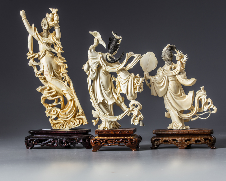 A group of three Chinese carved ivory maidens
