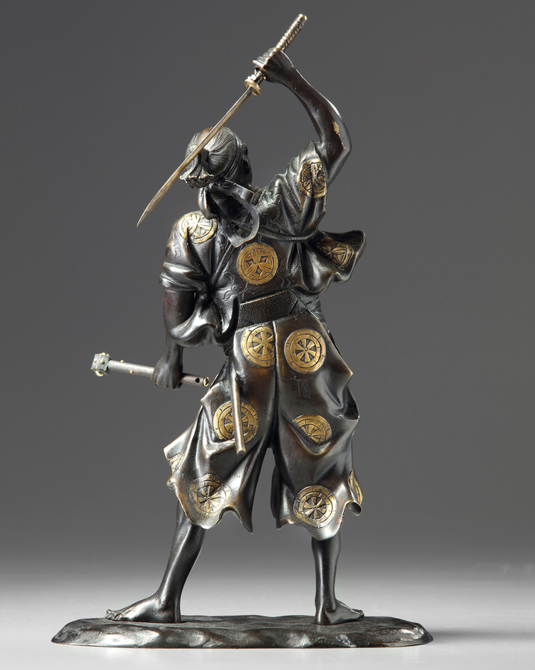 A Japanese bronze figure of a samurai