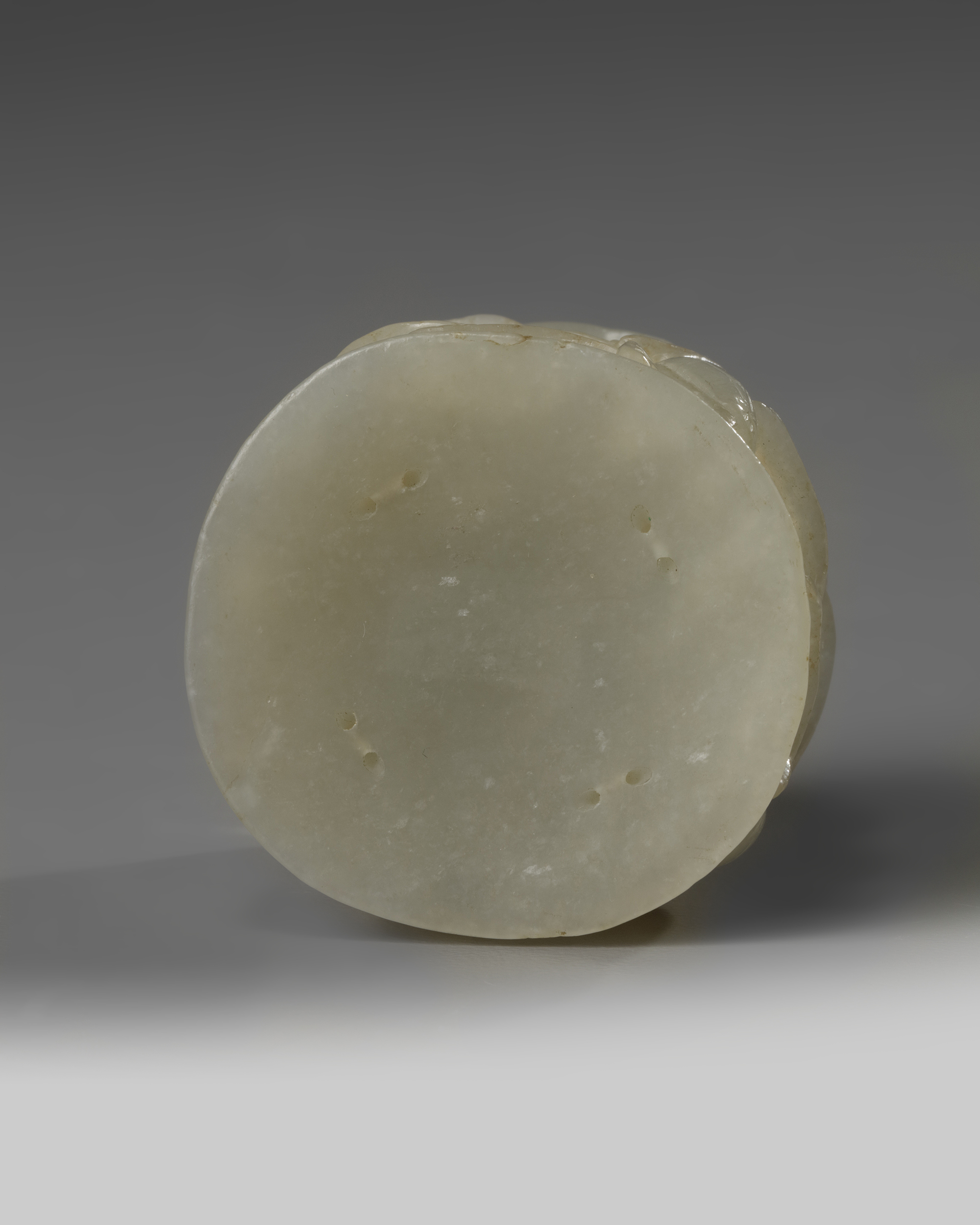 A Chinese celadon jade 'crane and lotus' hat finial