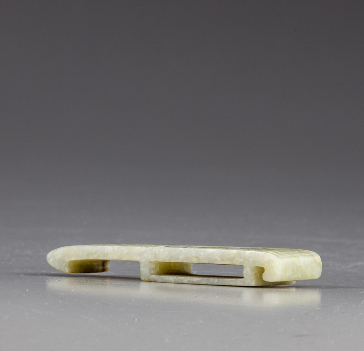A Chinese celadon jade sword slide