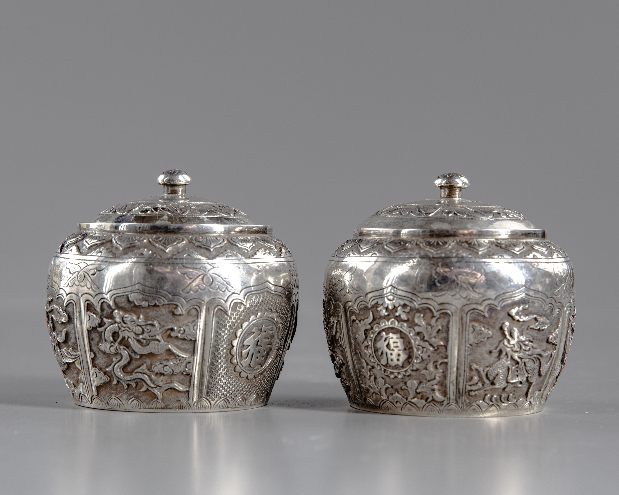 A PAIR OF CHINESE SILVER POTS WITH COVERS, 19TH-20TH CENTURY