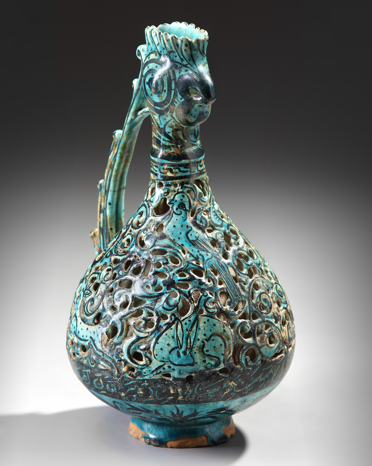 A RARE FRITWARE OPENWORK DECORATED RETICULATED EWER WITH ROOSTER HEAD ...