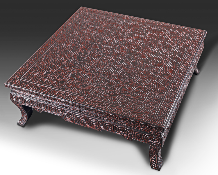 A LOW SQUARE CHINESE TSUISHITSU (CARVED LACQUER LACQUERWARE TABLE