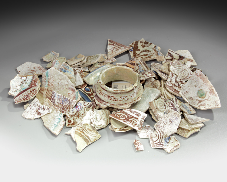 A LARGE GROUP OF RAQQA LUSTREWARE FRAGMENTS AND VASE NECK, SYRIA, 12TH ...