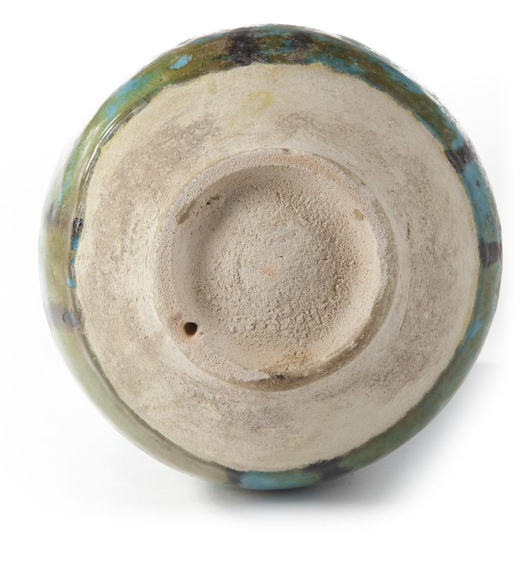 A RAQQA WARE VESSEL, SYRIA, FIRST HALF 13TH CENTURY