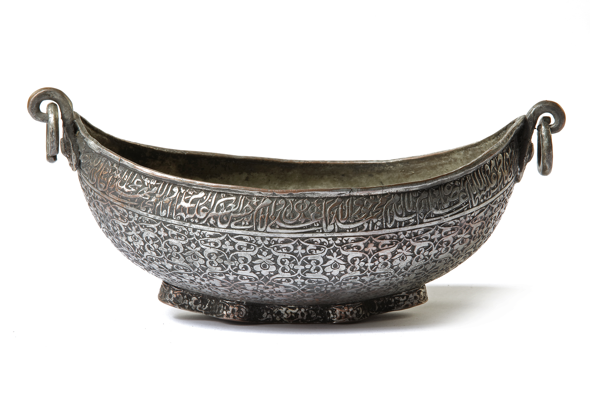 A PERSIAN TINNED-COPPER KASHKUL, 18TH CENTURY