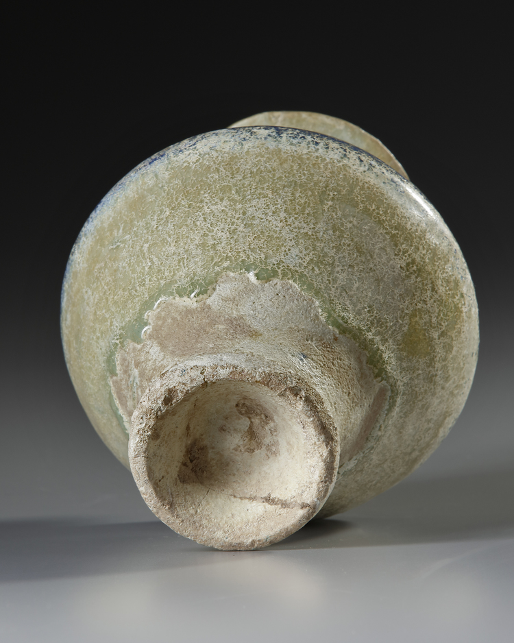 A RAQQA BLUE AND WHITE POTTERY JAR, SYRIA, 13TH CENTURY