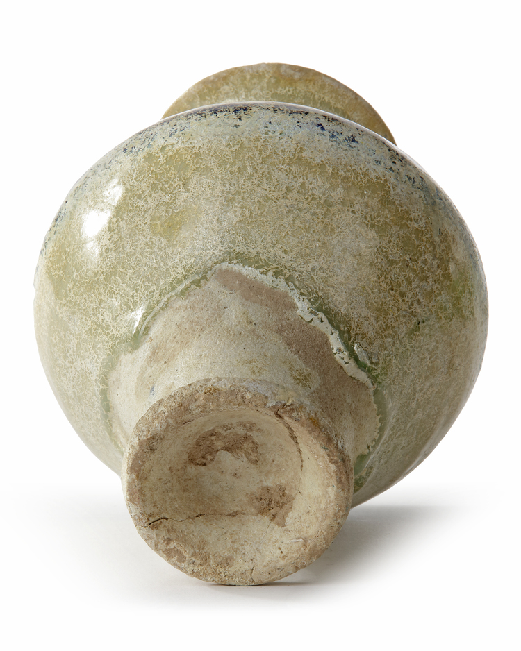 A RAQQA BLUE AND WHITE POTTERY JAR, SYRIA, 13TH CENTURY