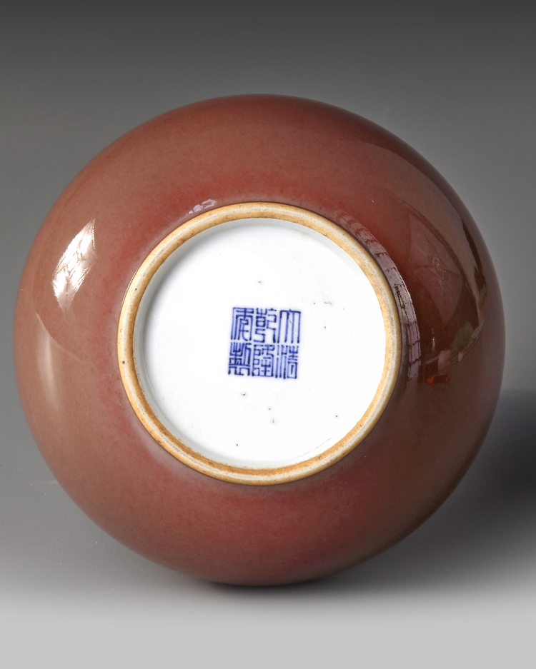 A CHINESE RED-GLAZED PEAR-SHAPED VASE, QIANLONG SEAL MARK IN UNDERGLAZE ...
