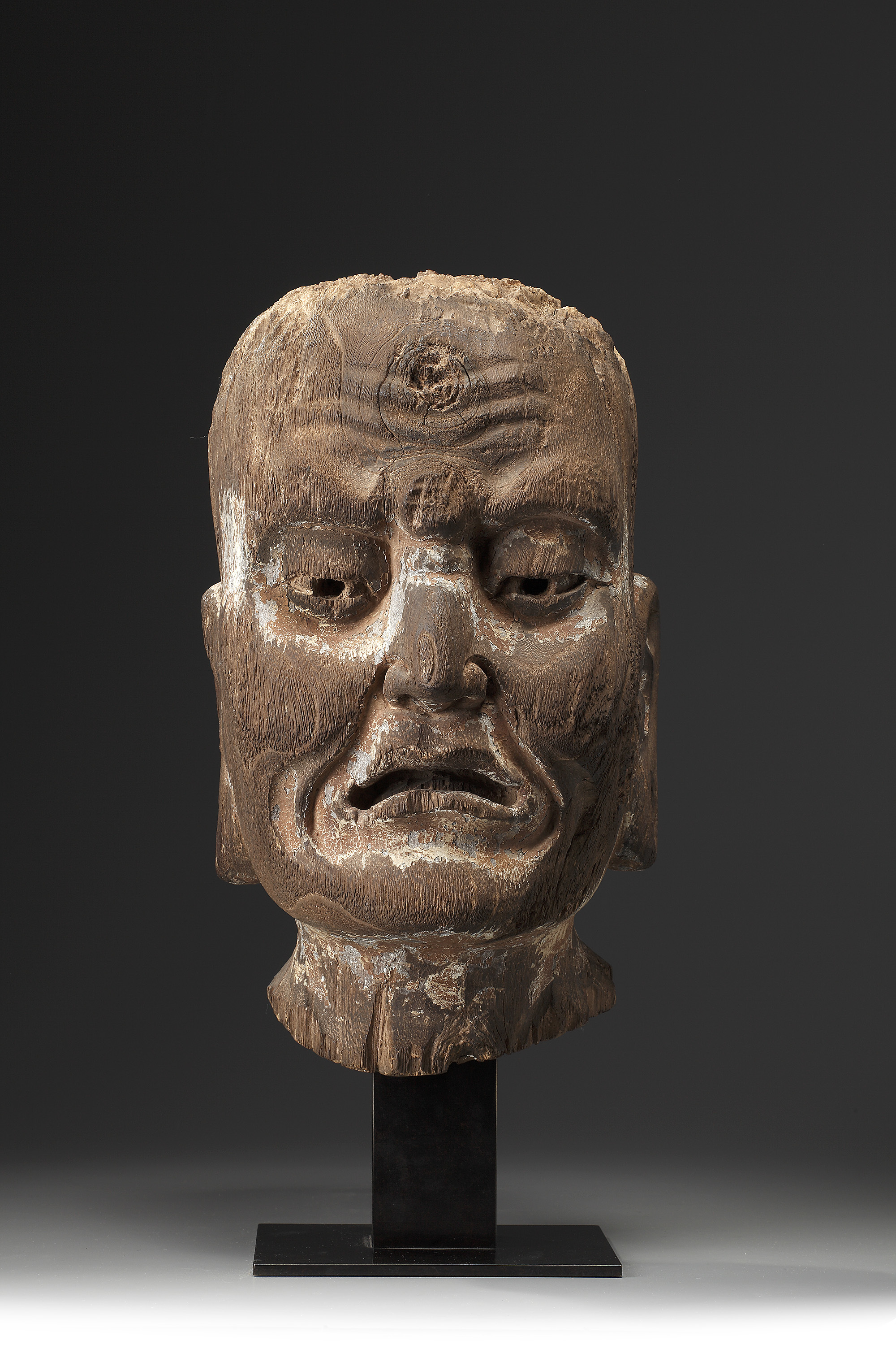An impressive Chinese wooden head of a Luohan