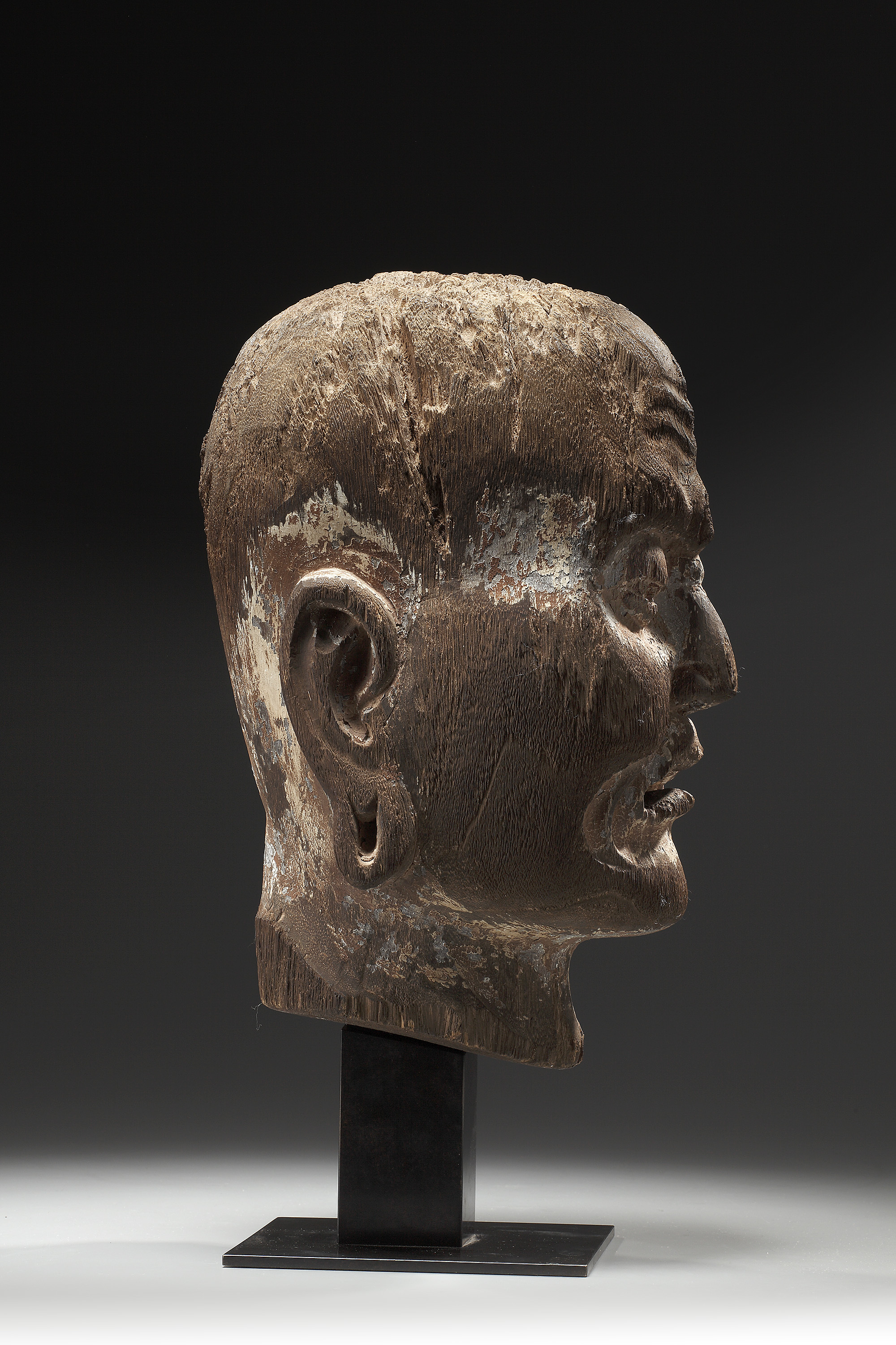 An impressive Chinese wooden head of a Luohan