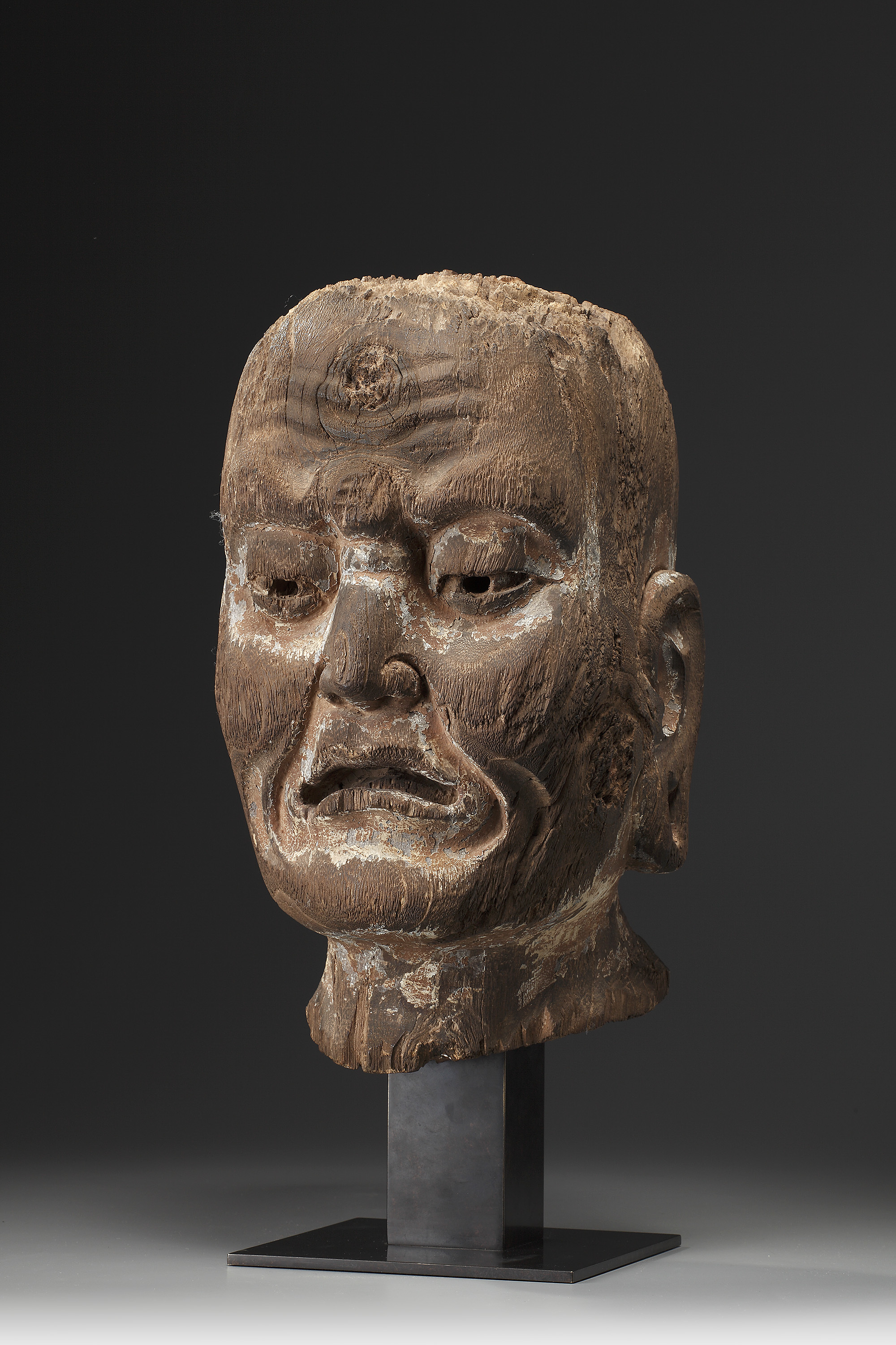 An impressive Chinese wooden head of a Luohan