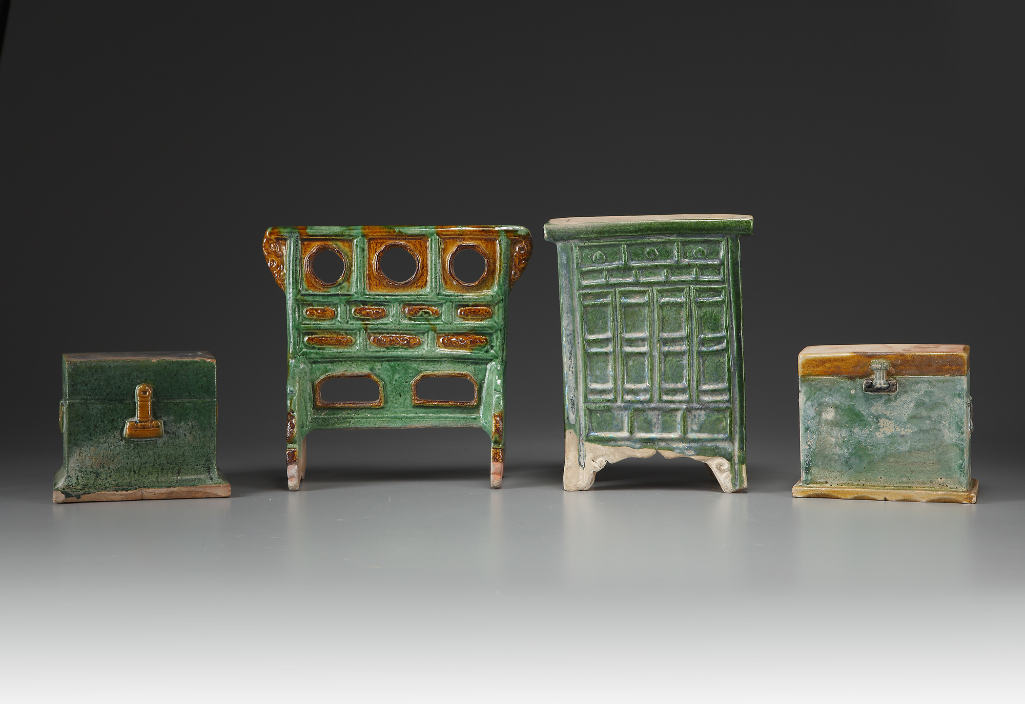 A Set Of Four Earthenware Funerary Objects