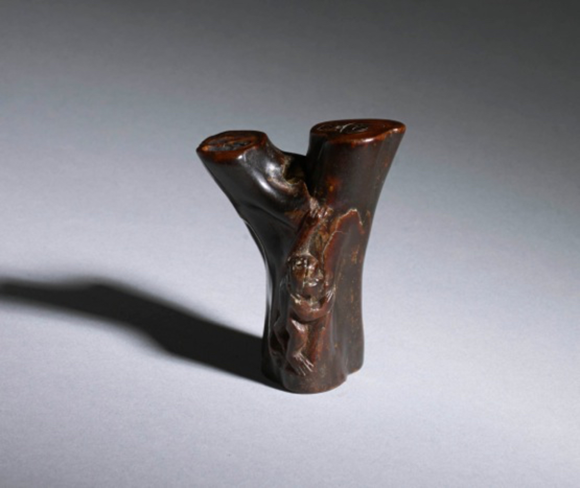 Large umimatsu netsuke of a monkey by a tree