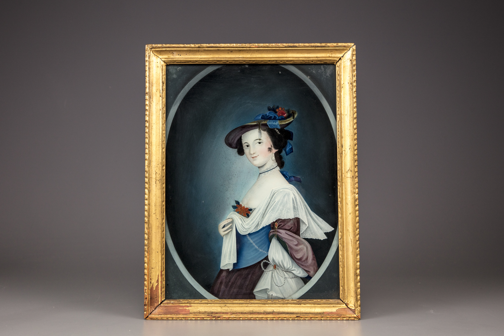 A Chinese export reverse-glass portrait of a European lady