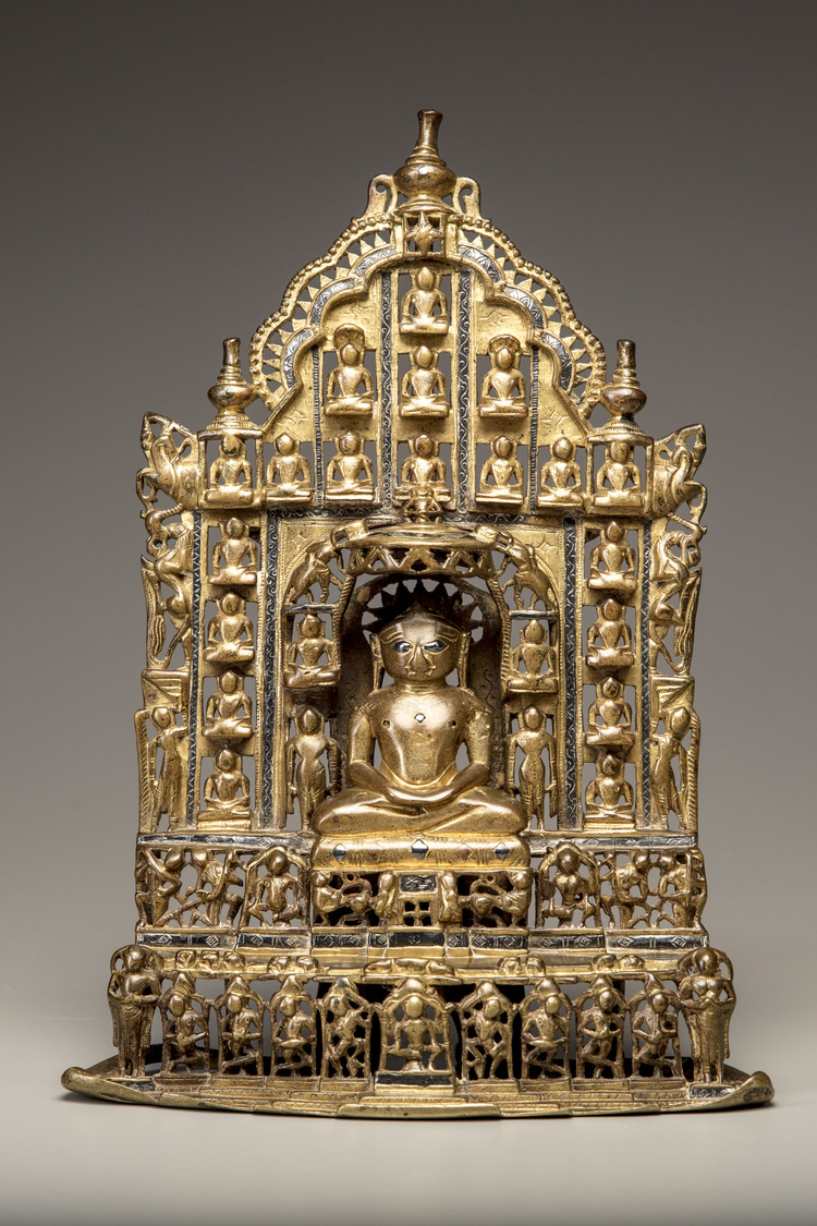 A gilt bronze Jain Tirthankara with silver inlay