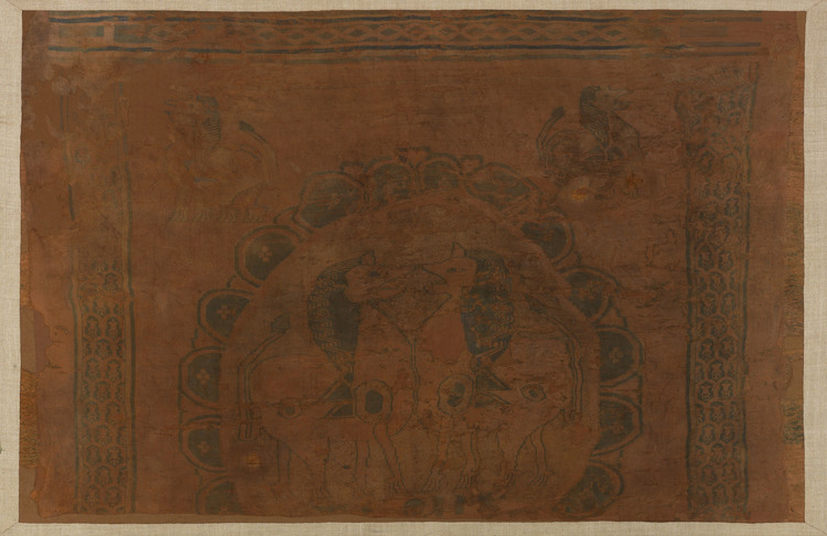 A SOGDIAN TEXTILE, DEPICTING TWO CONFRONTING LIONS, WITH INSCRIPTION ...