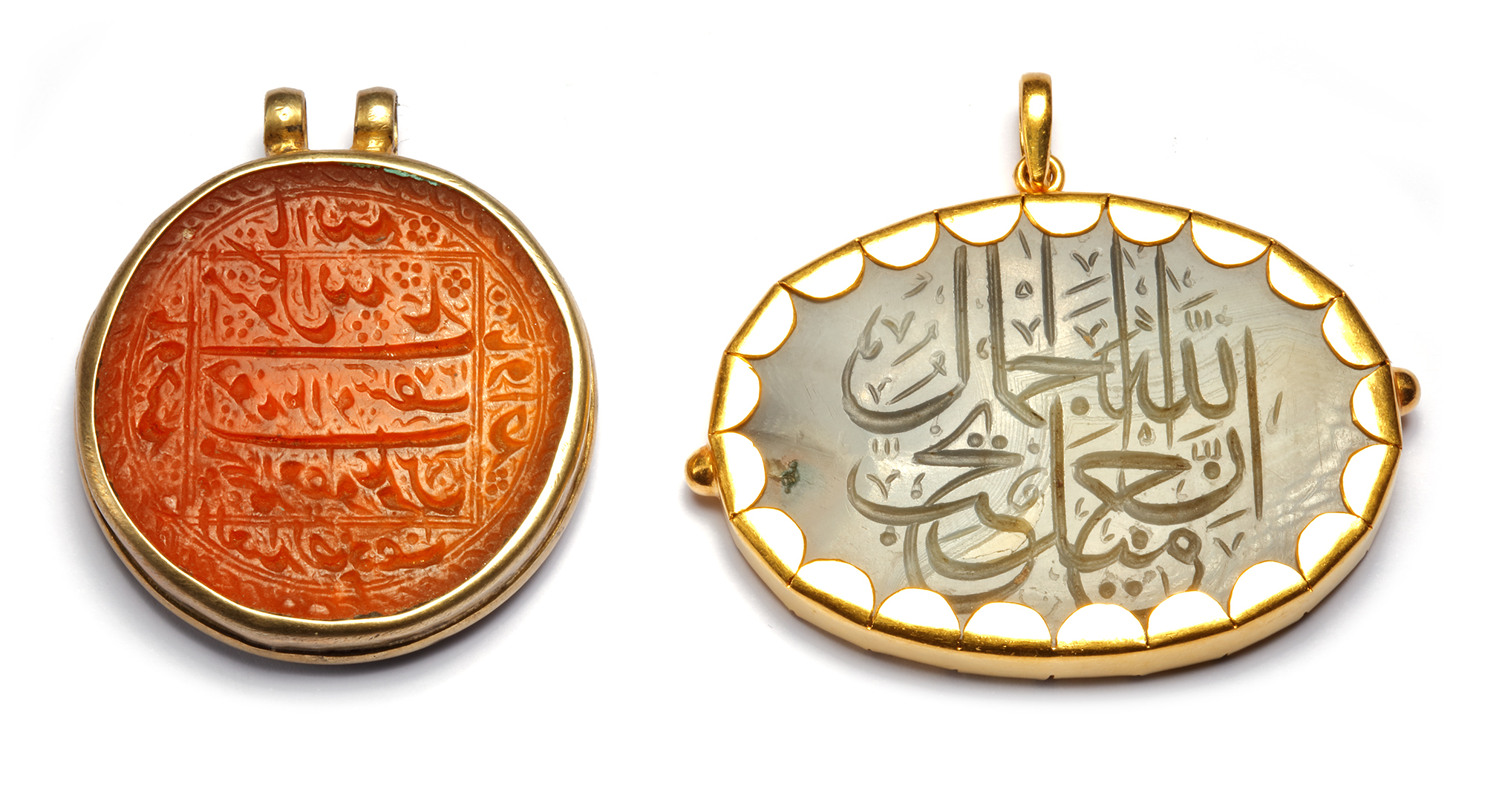 TWO AGATE AND JADE PENDANTS