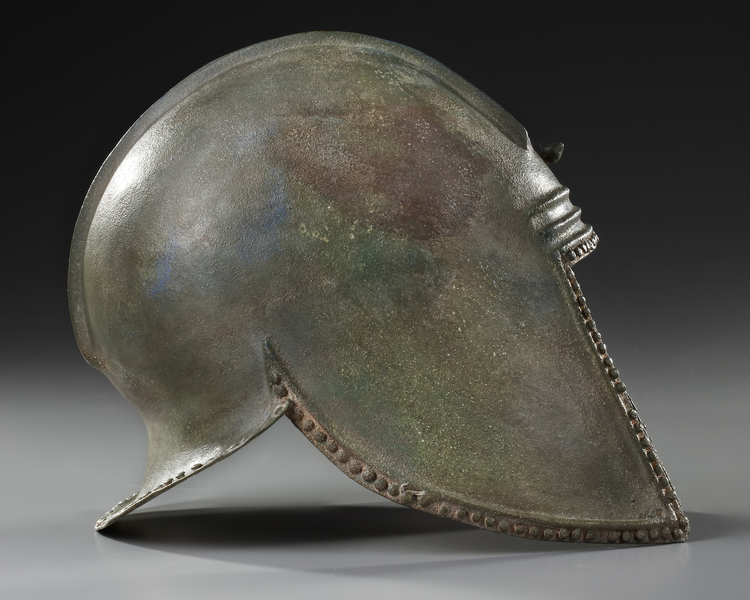 A GREEK BRONZE ILLYRIAN HELMET, CIRCA 6TH-5TH CENTURY B.C.