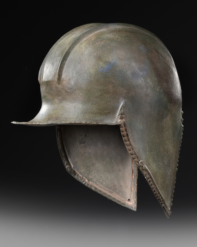 A GREEK BRONZE ILLYRIAN HELMET, CIRCA 6TH-5TH CENTURY B.C.