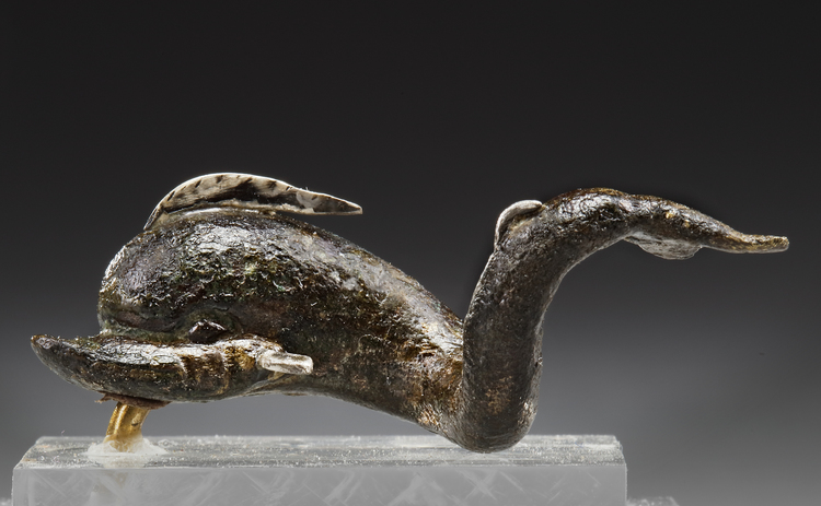 A ROMAN BRONZE DOLPHIN FIGURE, CIRCA 1ST- 2ND CENTURY A.D.