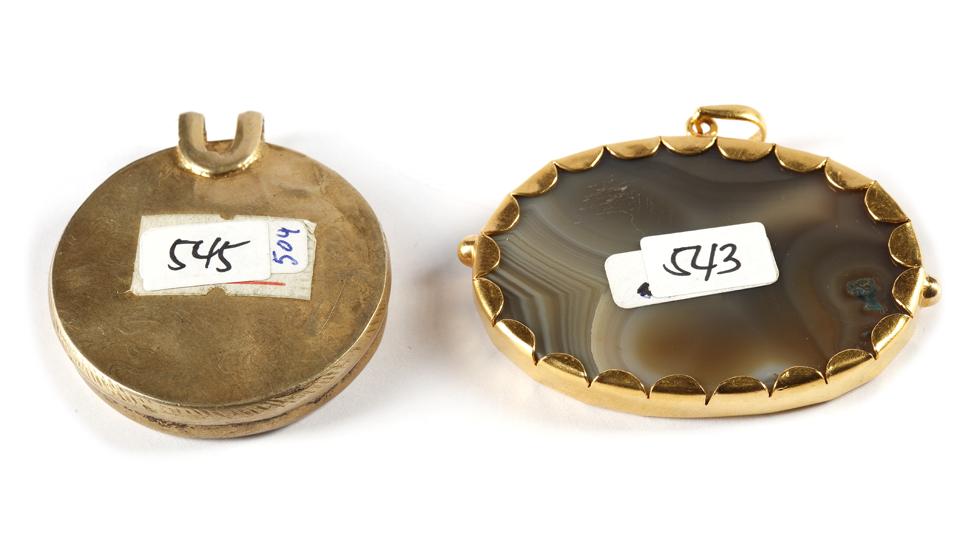 TWO AGATE AND JADE PENDANTS