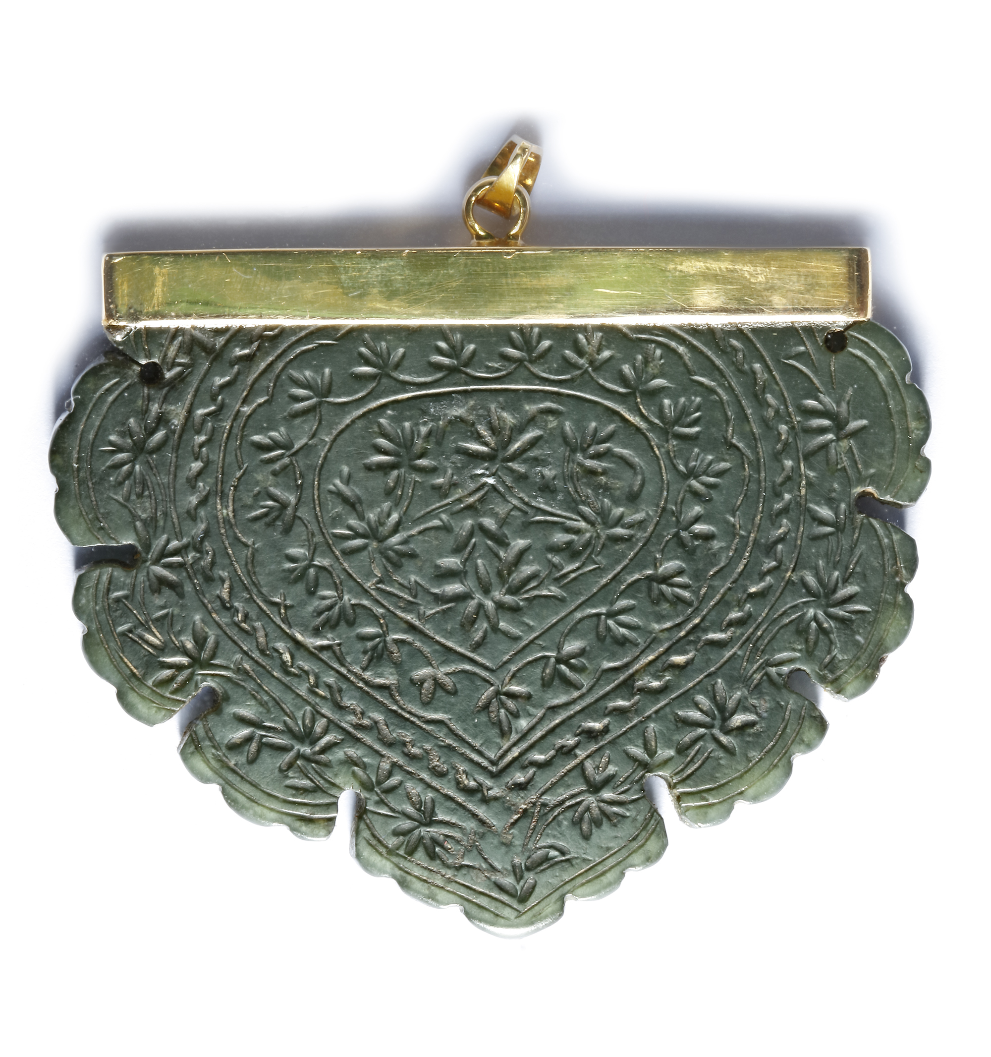 A JADE CARVED TALISMANIC PENDANT