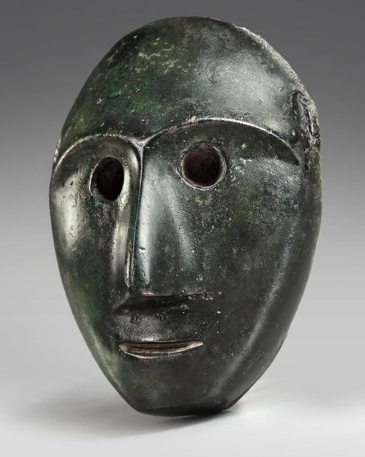 A WESTERN PERSIAN BRONZE MALE MASK, CIRCA 1200-800 B.C.