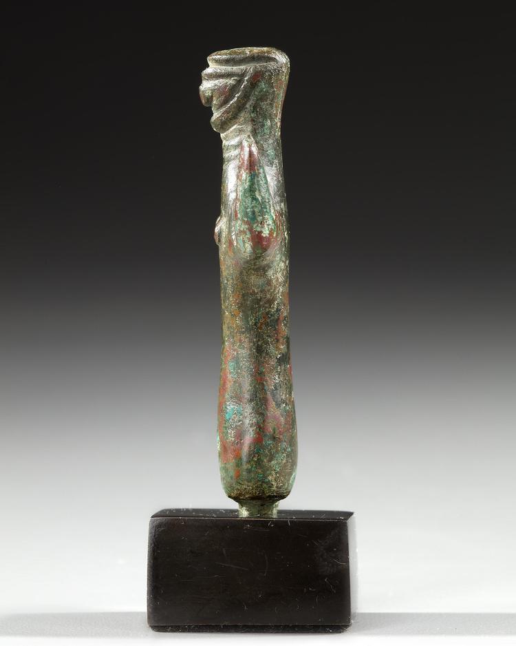 AN ELAMITE BRONZE FEMALE FIGURE, CIRCA 2ND MILLENNIUM B.C.
