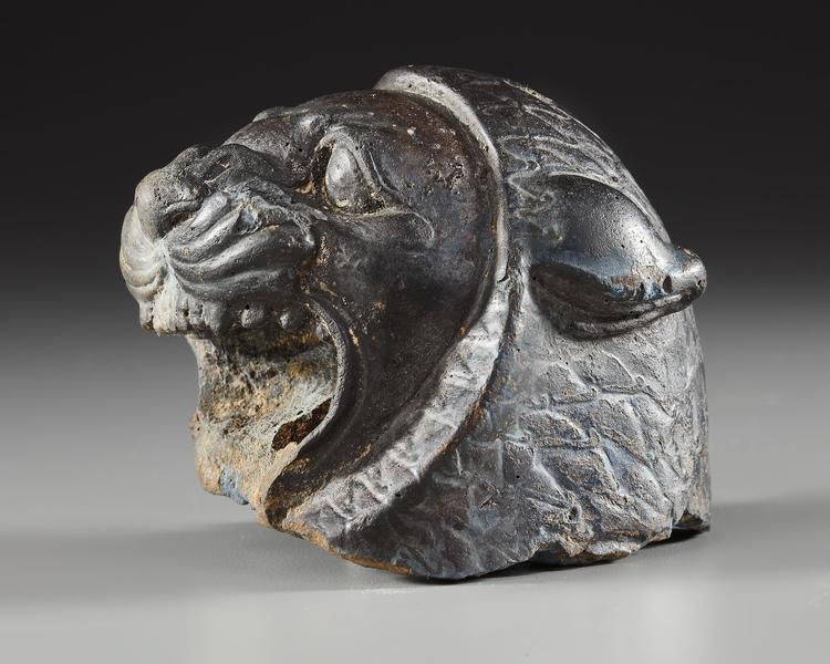 AN ACHAEMENID RHYTON HEADPIECE FORM OF A ROARING LION, CIRCA 5TH ...
