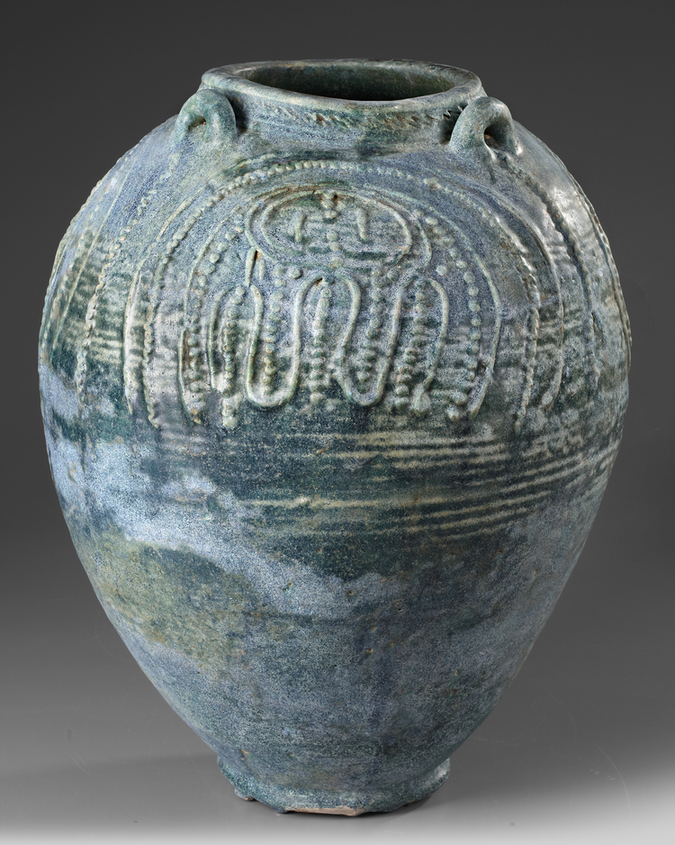 A LARGE POST SASSANIAN TURQUOISE GLAZED POTTERY STORAGE JAR, PERSIA OR ...
