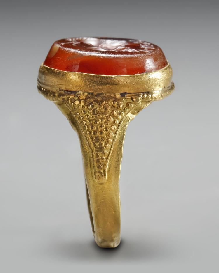 A ROMAN GRYLLUS INTAGLIO SET IN A GOLD RING, CIRCA 2ND-3RD CENTURY A.D.