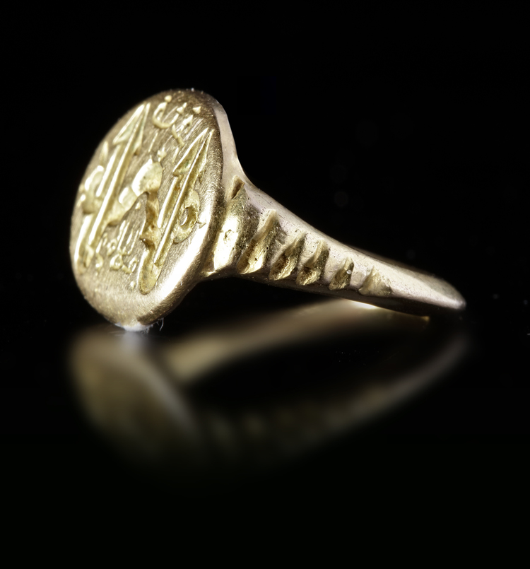 A GOLD SEAL RING