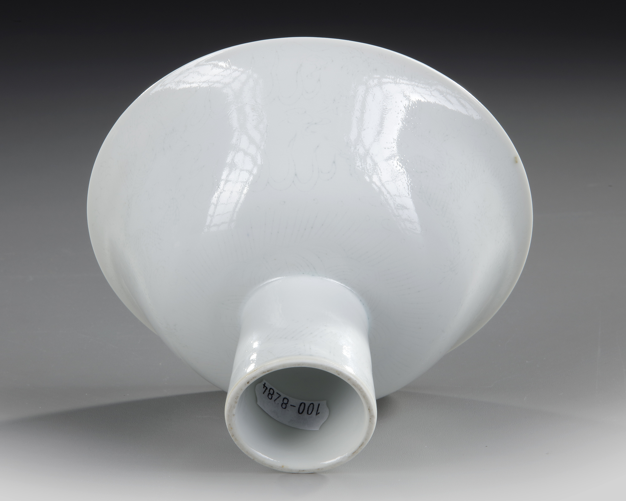 A CHINESE WHITE-GLAZED ANHUA DRAGON STEM CUP, EARLY 18TH CENTURY