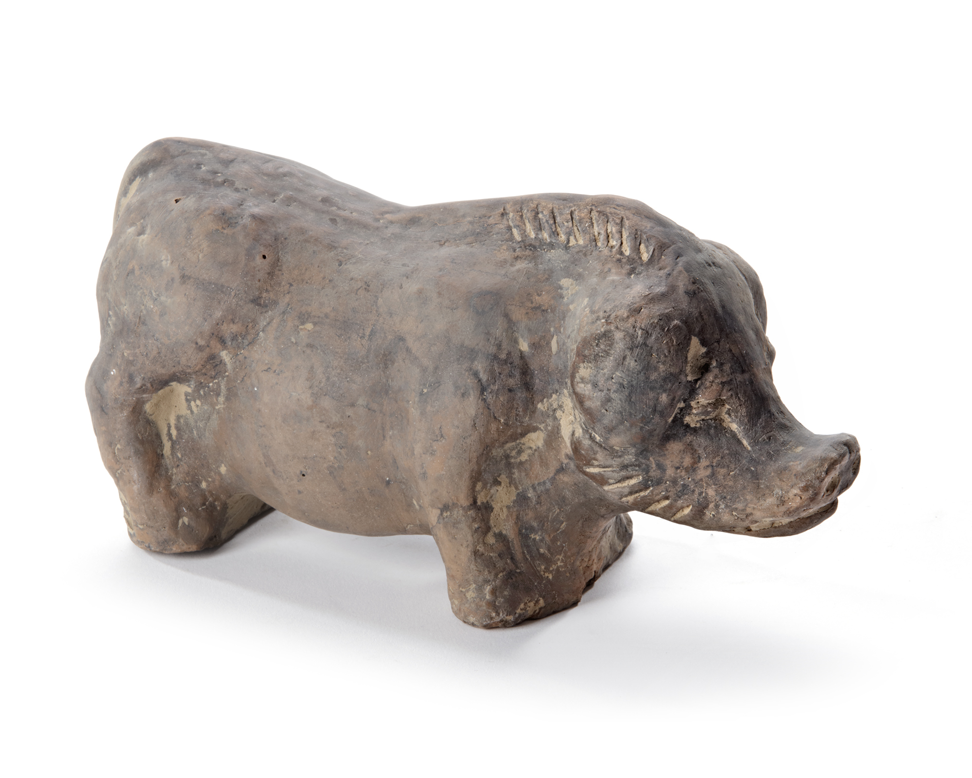 A CHINESE POTTERY FIGURE OF A BOAR, HAN DYNASTY (206 BC-220 AD)