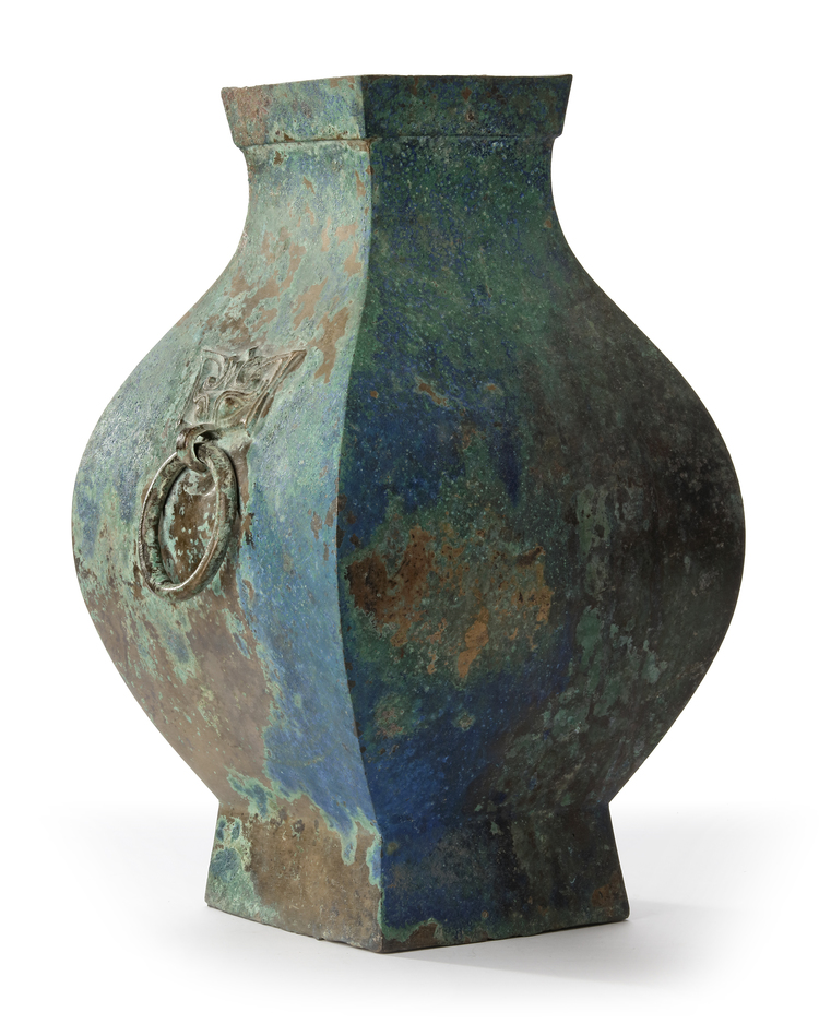 A CHINESE BRONZE SQUARE-SECTION TWIN-HANDLED HU VASE, HAN DYNASTY (206 ...