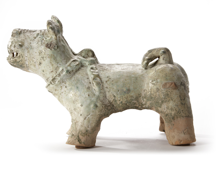 A CHINESE GREEN-GLAZED POTTERY DOG, HAN DYNASTY (206 BC-220 AD)