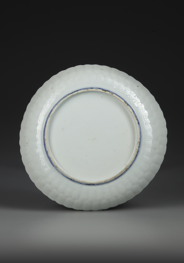 A CHINESE BLUE AND WHITE INCISED DECORATED DISH, WANLI PERIOD (1573-1619)